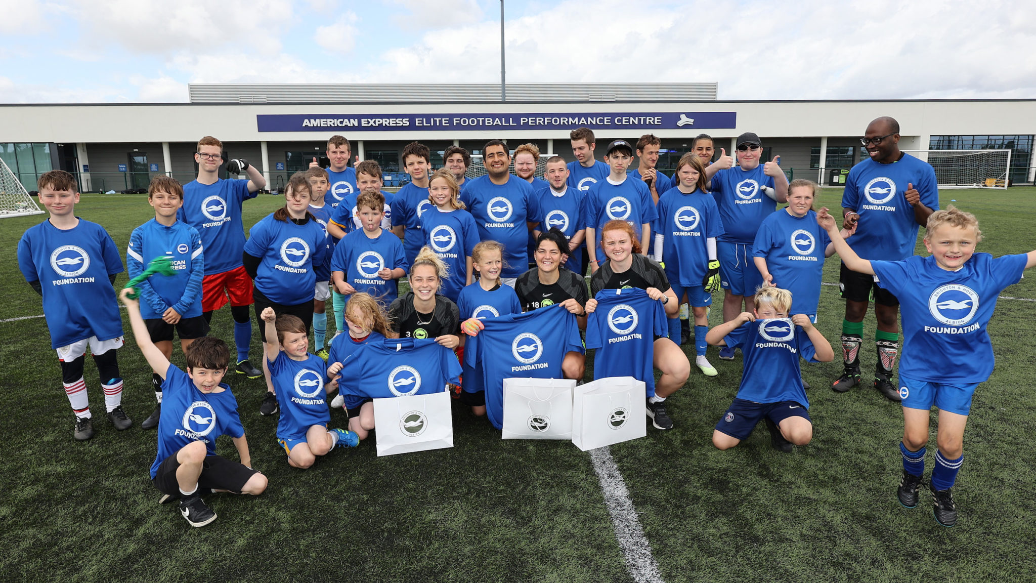 First team stars give out free t-shirts at disability football session ...