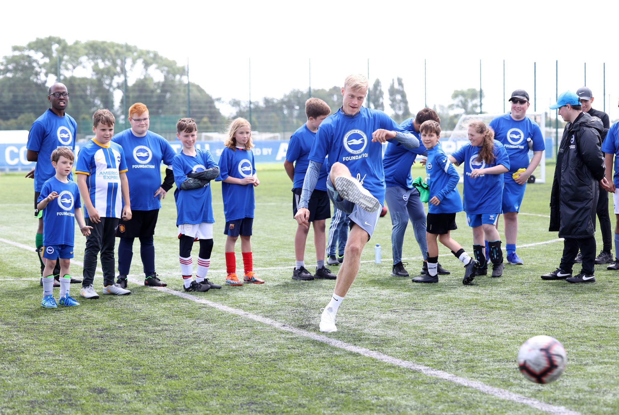 First team stars give out free t-shirts at disability football session ...
